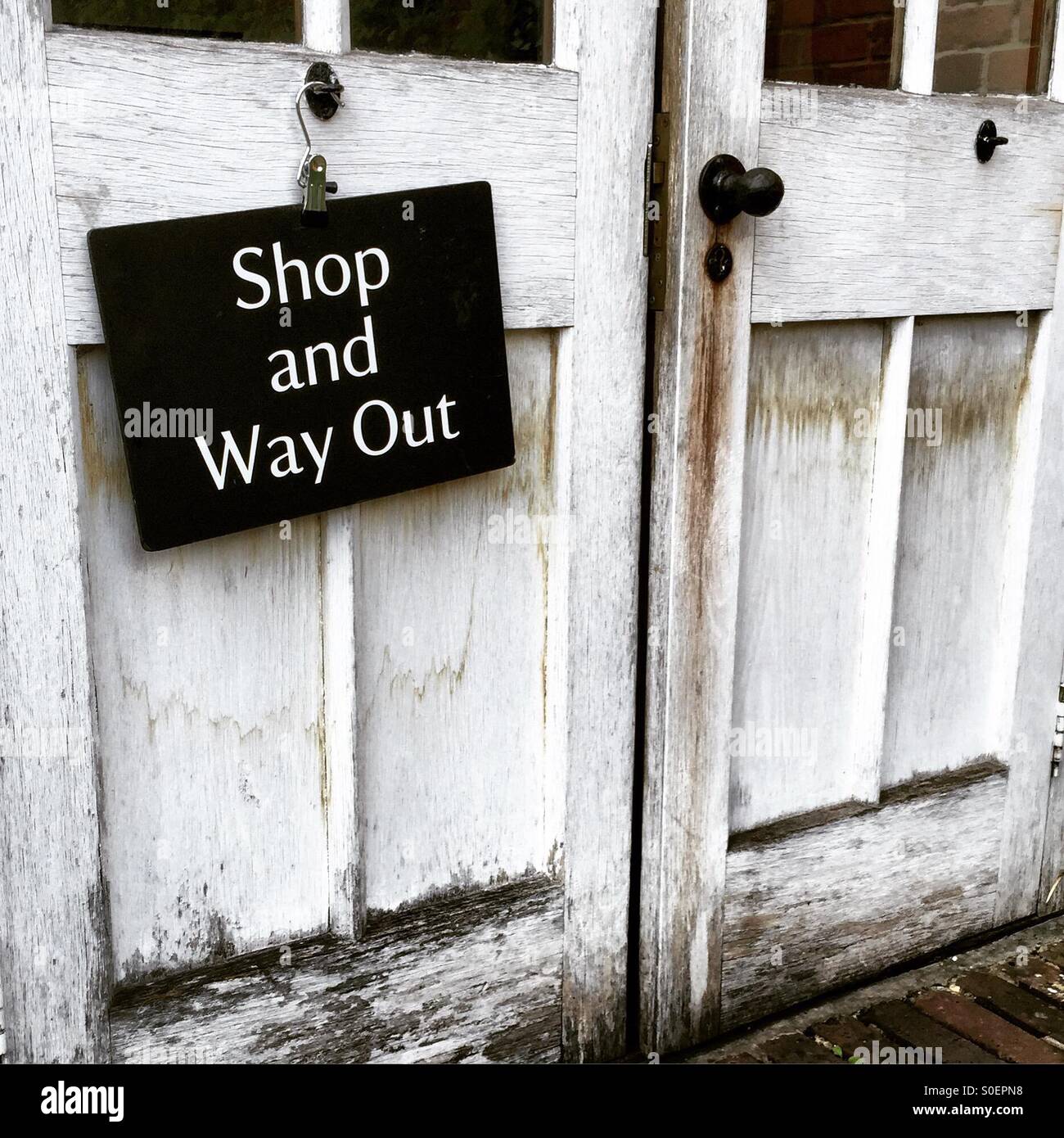 Way out and shop sign on wooden door Stock Photo - Alamy