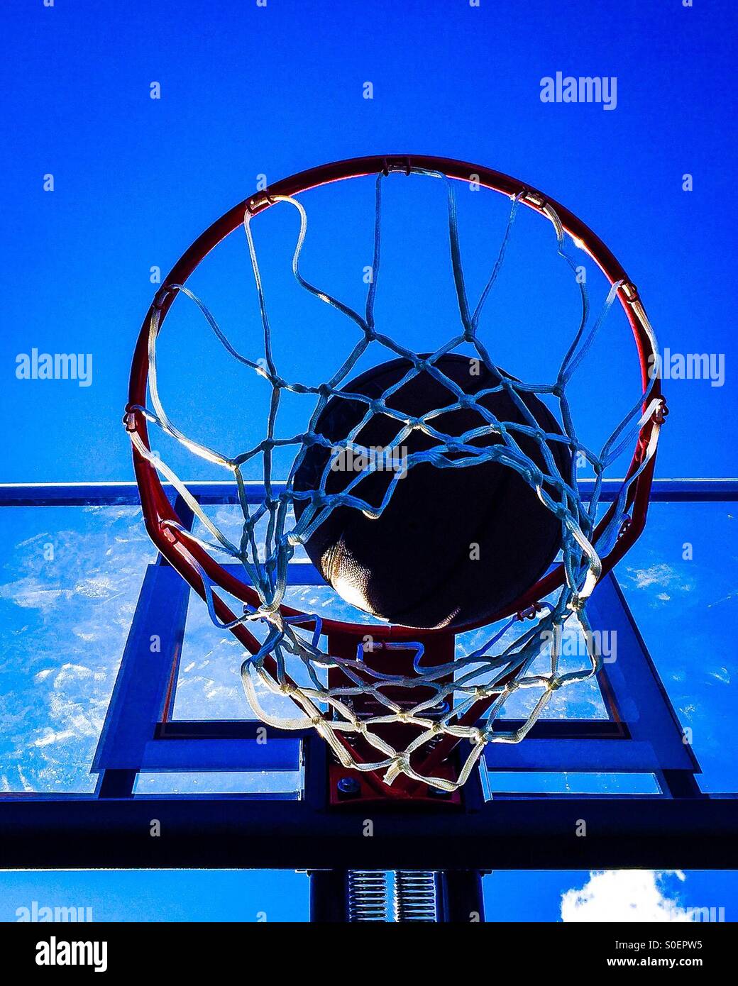 Basketball going through hoop hi-res stock photography and images - Alamy