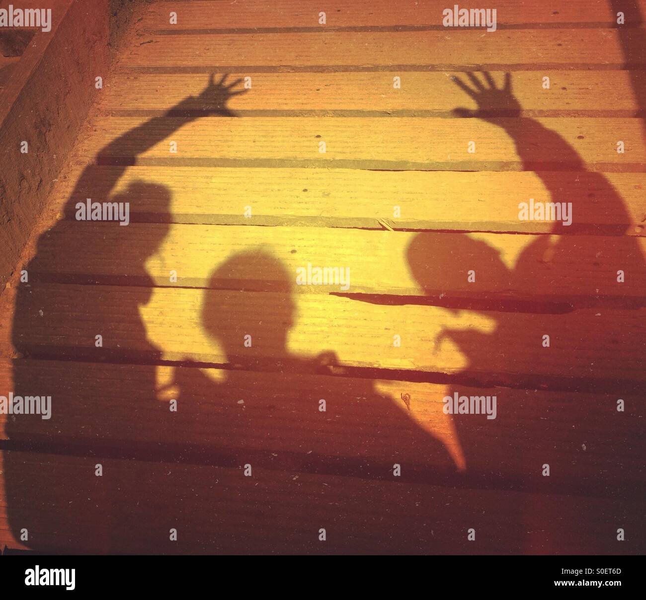 Shadows of three people Stock Photo - Alamy