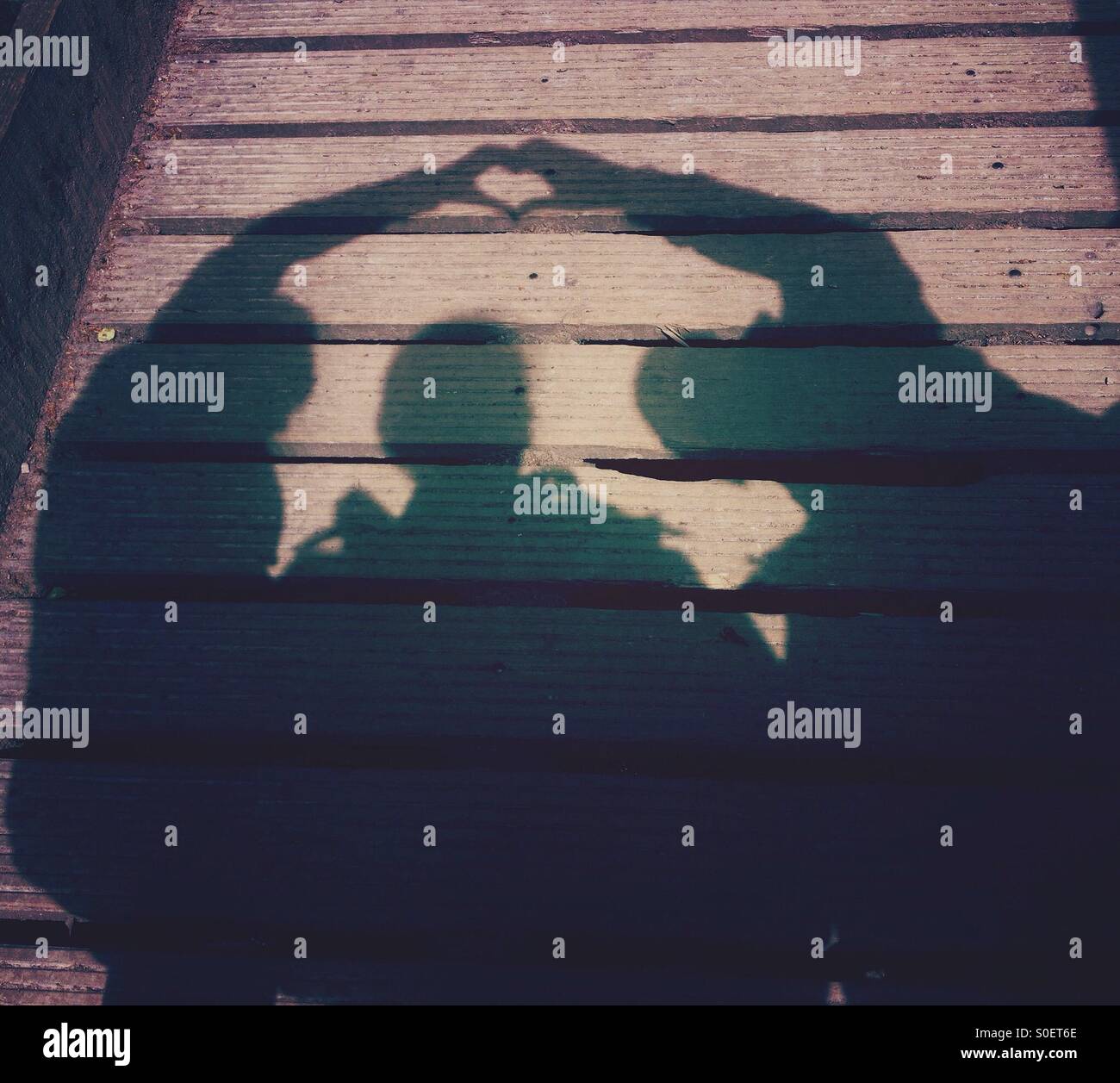 Shadows of three people Stock Photo - Alamy