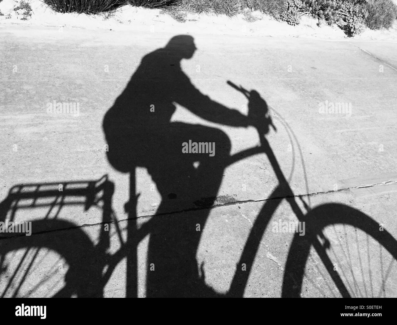 Black male riding bicycle Black and White Stock Photos & Images - Alamy