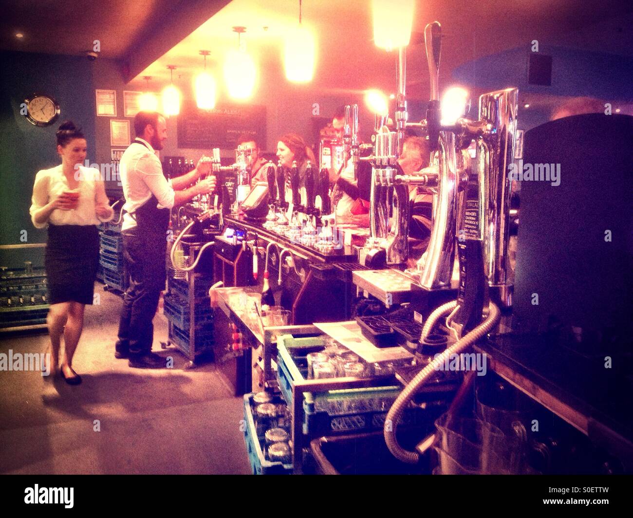 Behind the bar Stock Photo - Alamy