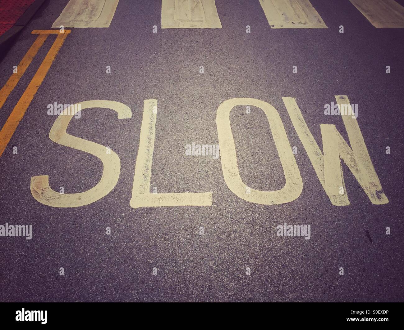 Slow road marking hi-res stock photography and images - Alamy