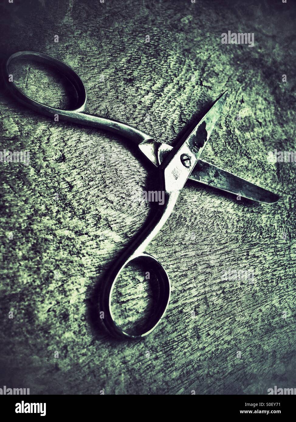 Open Scissors on a Wooden Surface Stock Photo - Alamy