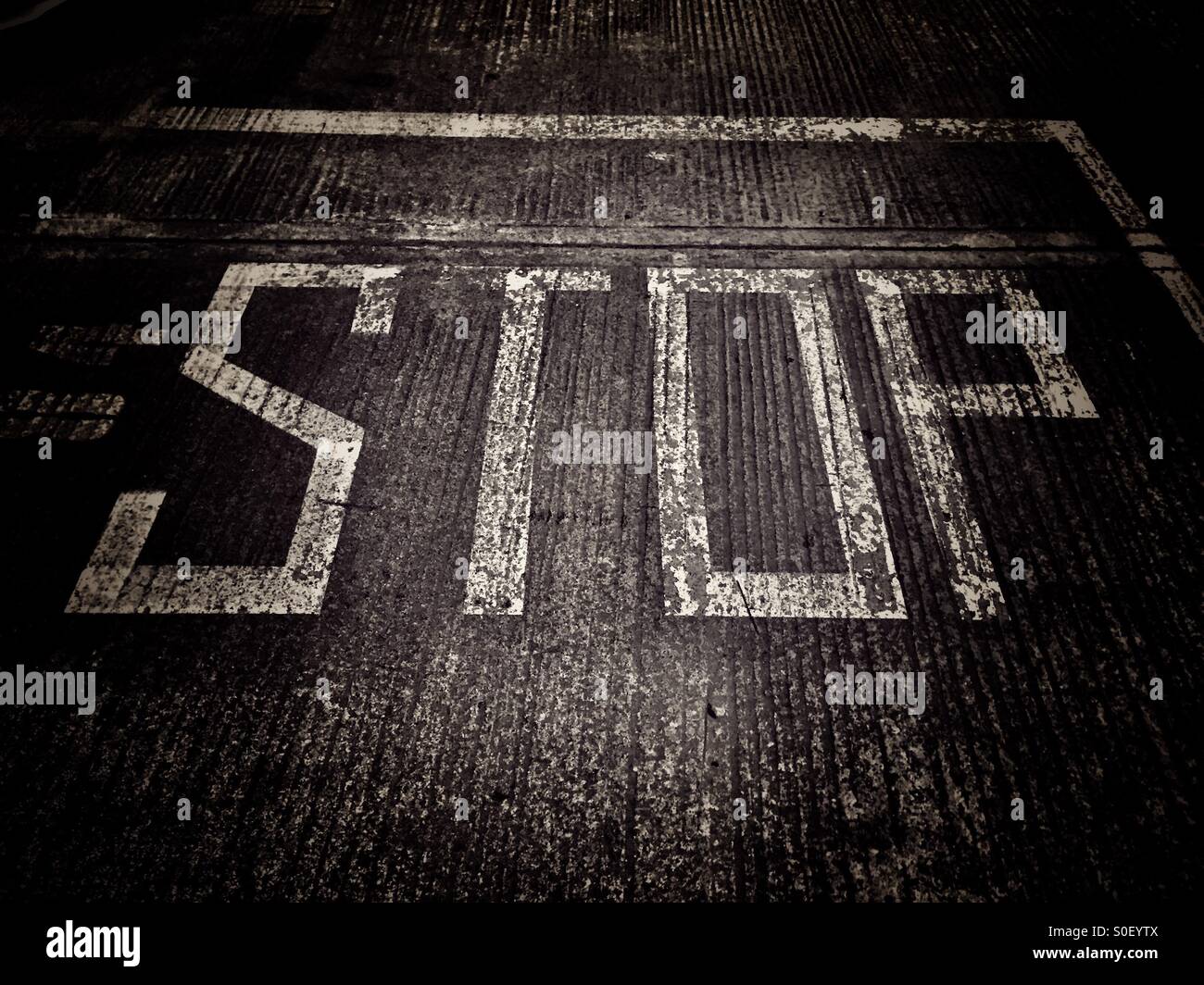 Stop sign on the road Stock Photo - Alamy