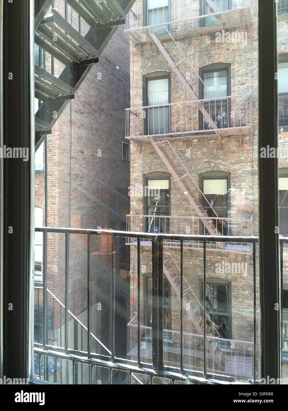 Window view of fire escape SoHo NYC Stock Photo - Alamy