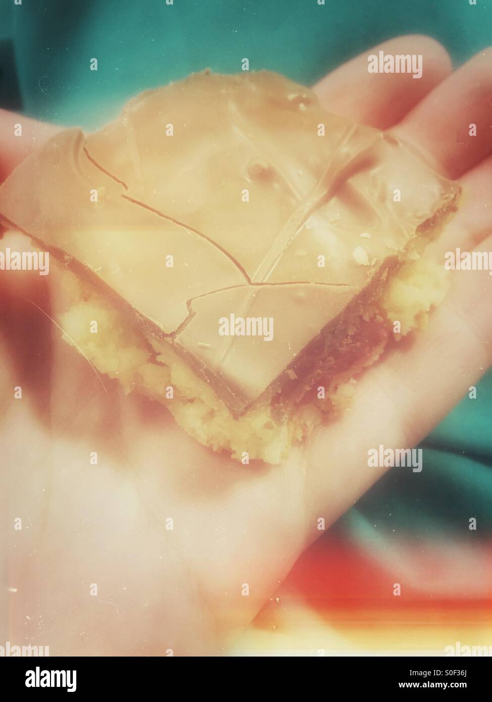 Hand giving cake Stock Photo - Alamy