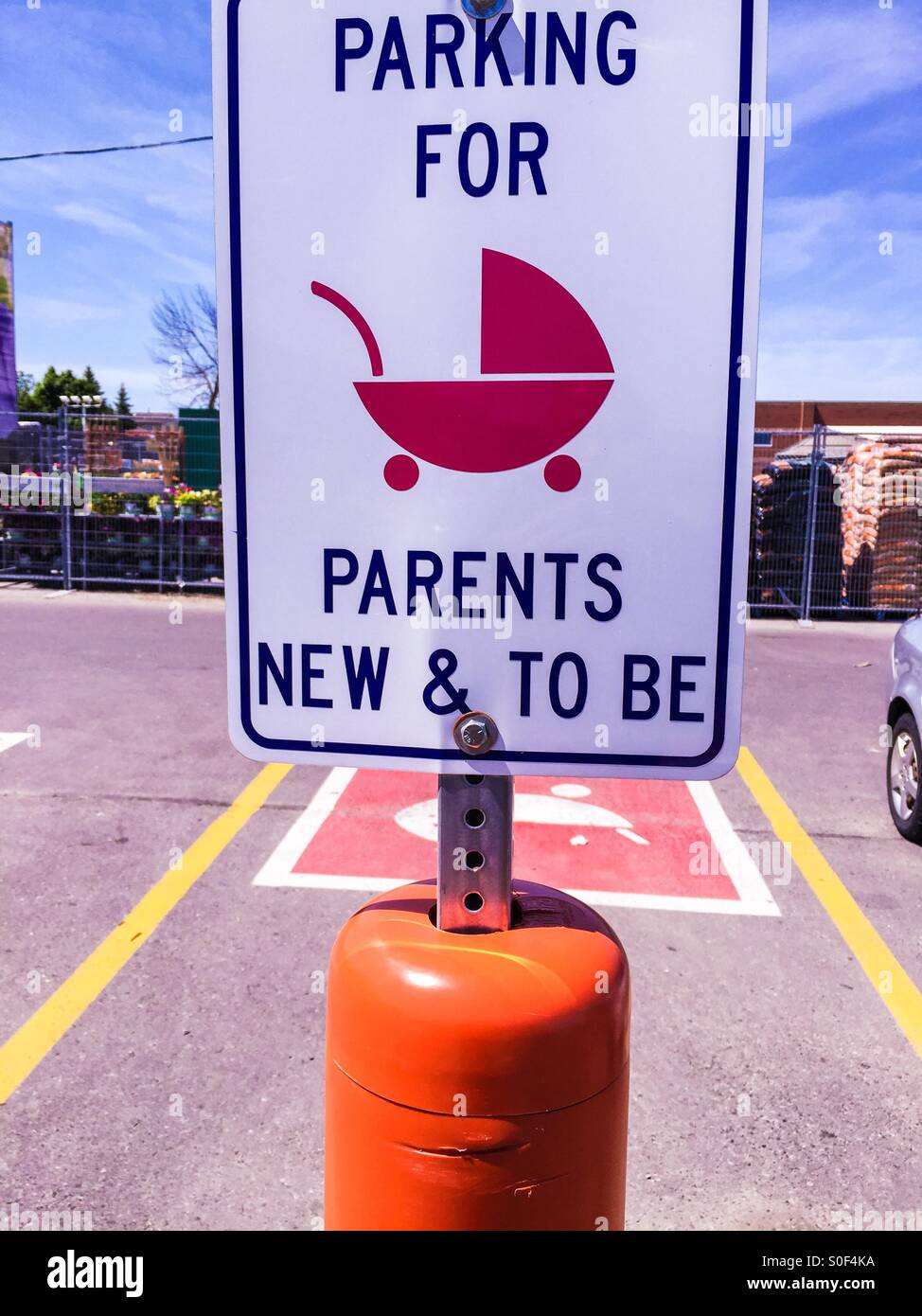Special parking spot in a big parking lot reserved for new parents and ...