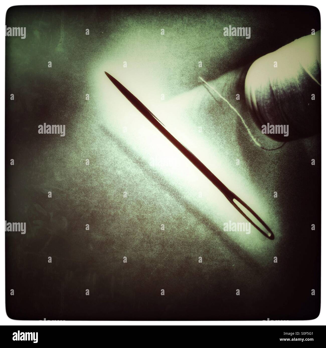 Needle and Thread Stock Photo - Alamy