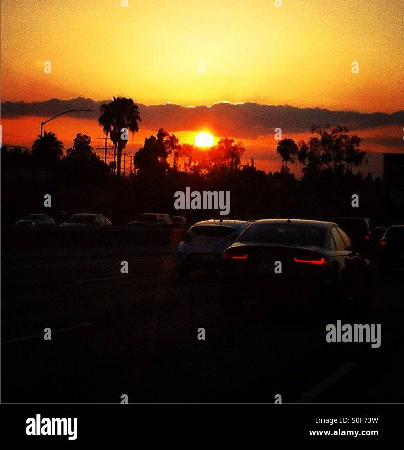 Driving into the sunset Stock Photo - Alamy