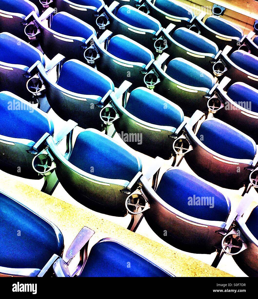 Bright blue stadium seating Stock Photo - Alamy