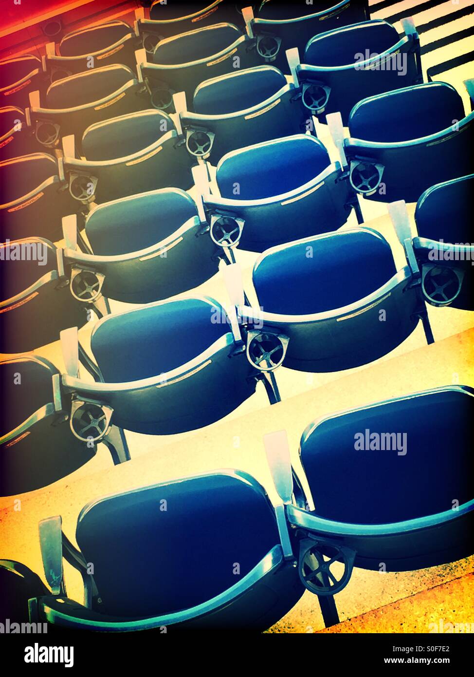 Bright blue stadium seating Stock Photo - Alamy