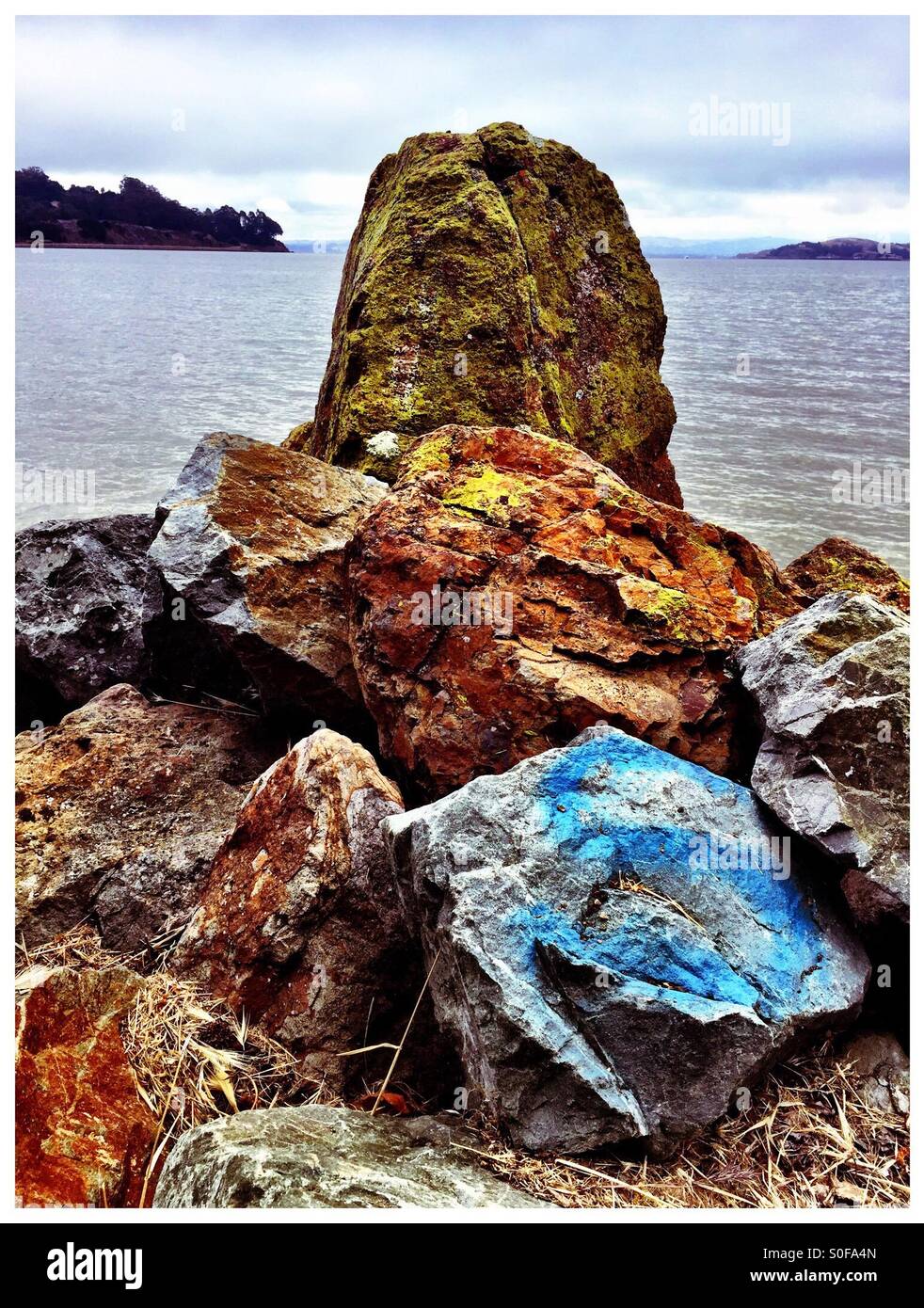 Rocks by water Stock Photo - Alamy