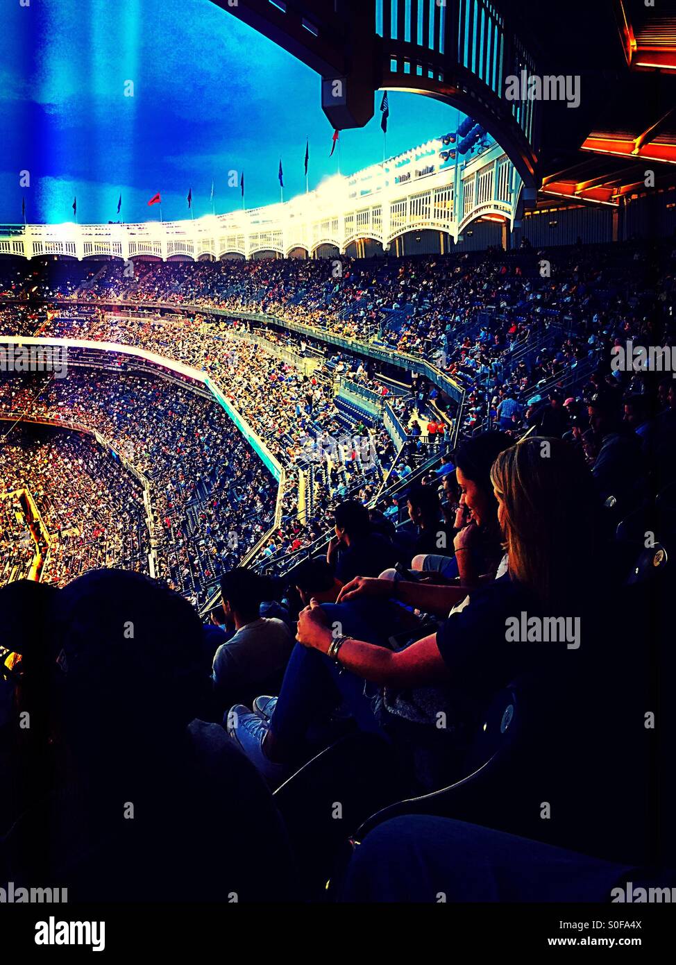 Yankee Stadium crowd at night game Stock Photo - Alamy