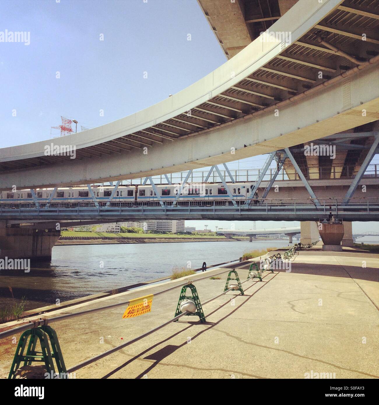 Tozai Line running Tokyo river Stock Photo - Alamy