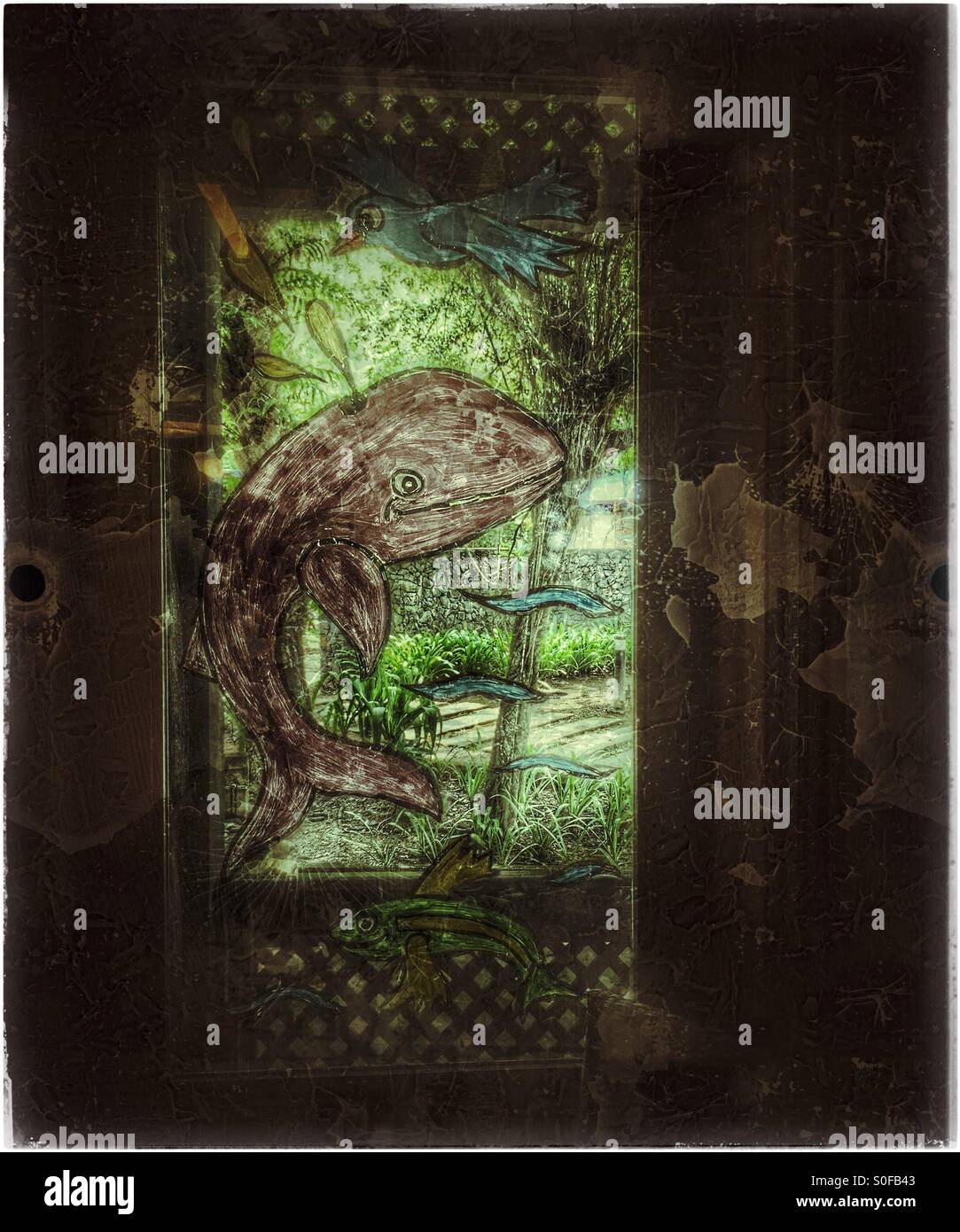 Creatures painted on a glass window Stock Photo - Alamy