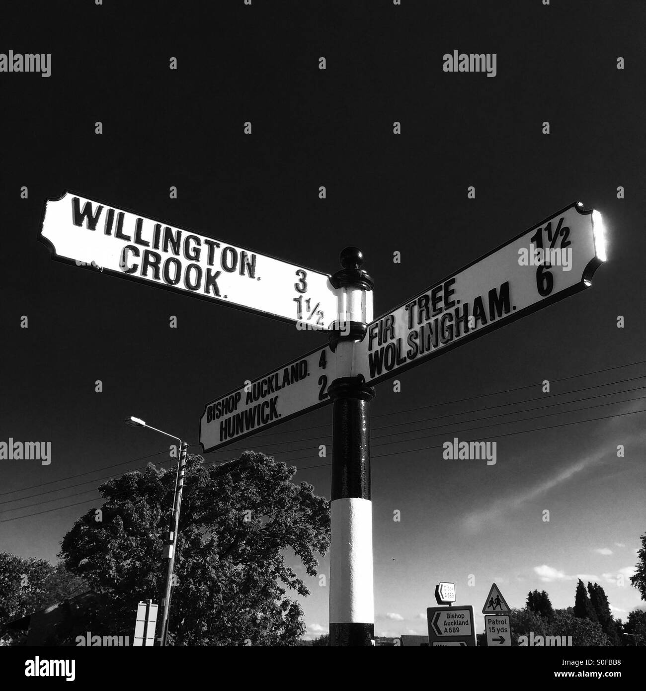 Old style restored road sign Stock Photo - Alamy
