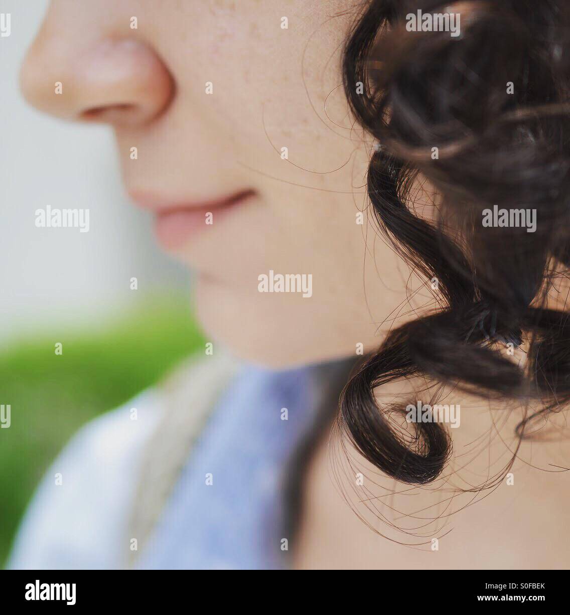 Beautiful lady with curly hair Stock Photo - Alamy