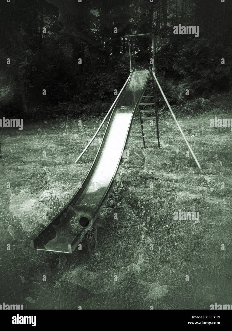 Steel kids slide Stock Photo - Alamy