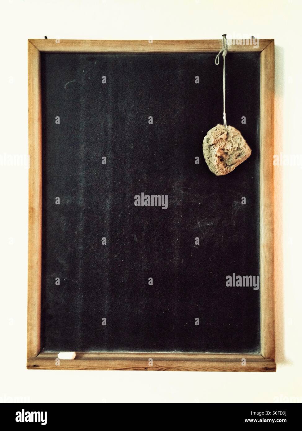 Blackboard with sponge Stock Photo - Alamy