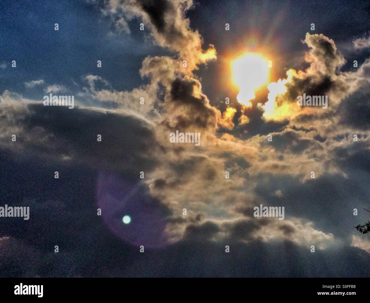 Sunshine through storm clouds hi-res stock photography and images - Alamy