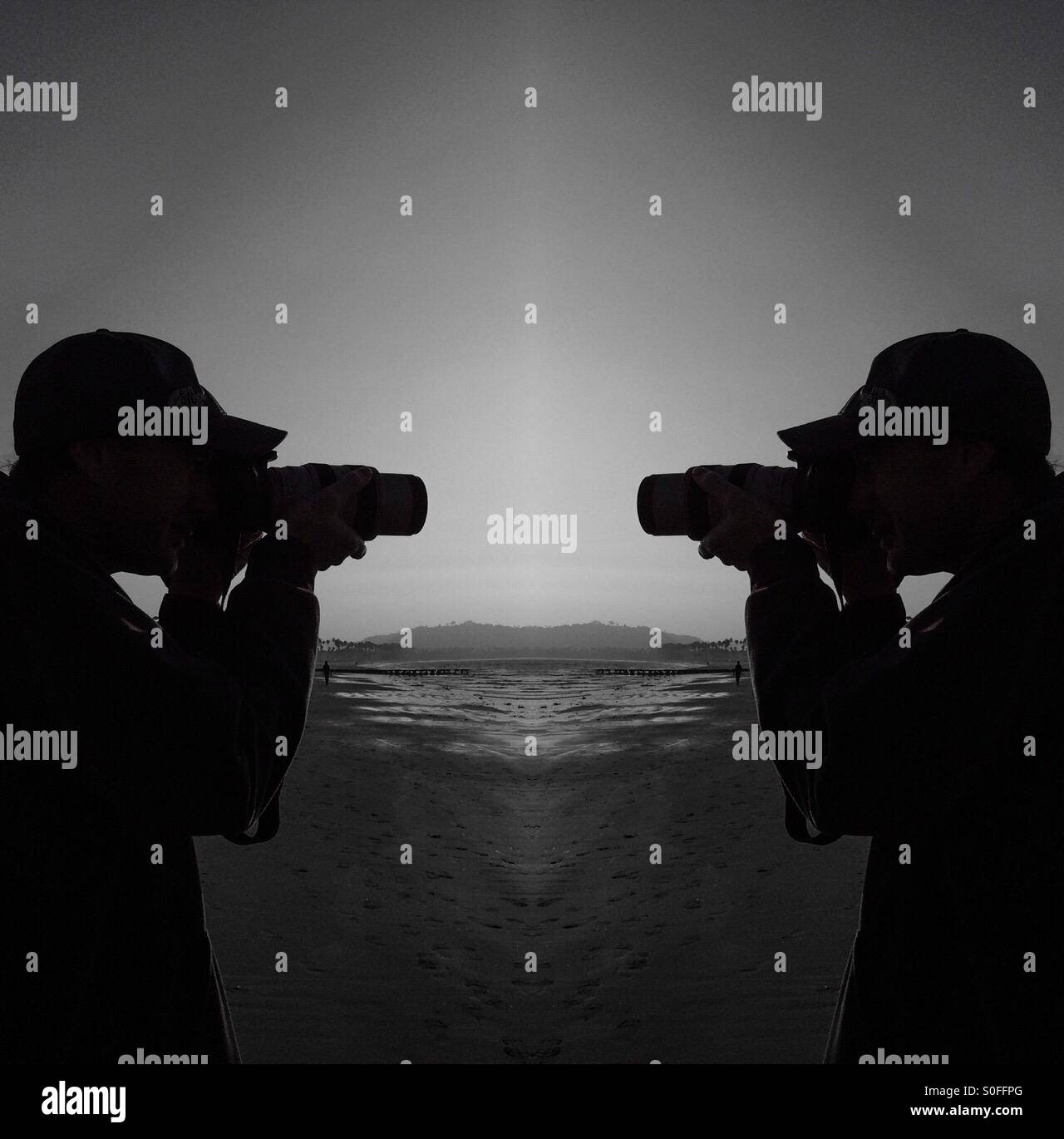 Mirror effect of a photographer taking a photo of himself Stock Photo ...