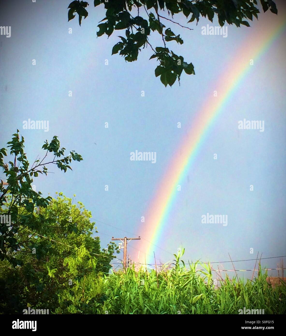 Vibrant rainbow and faint second rainbow Stock Photo - Alamy