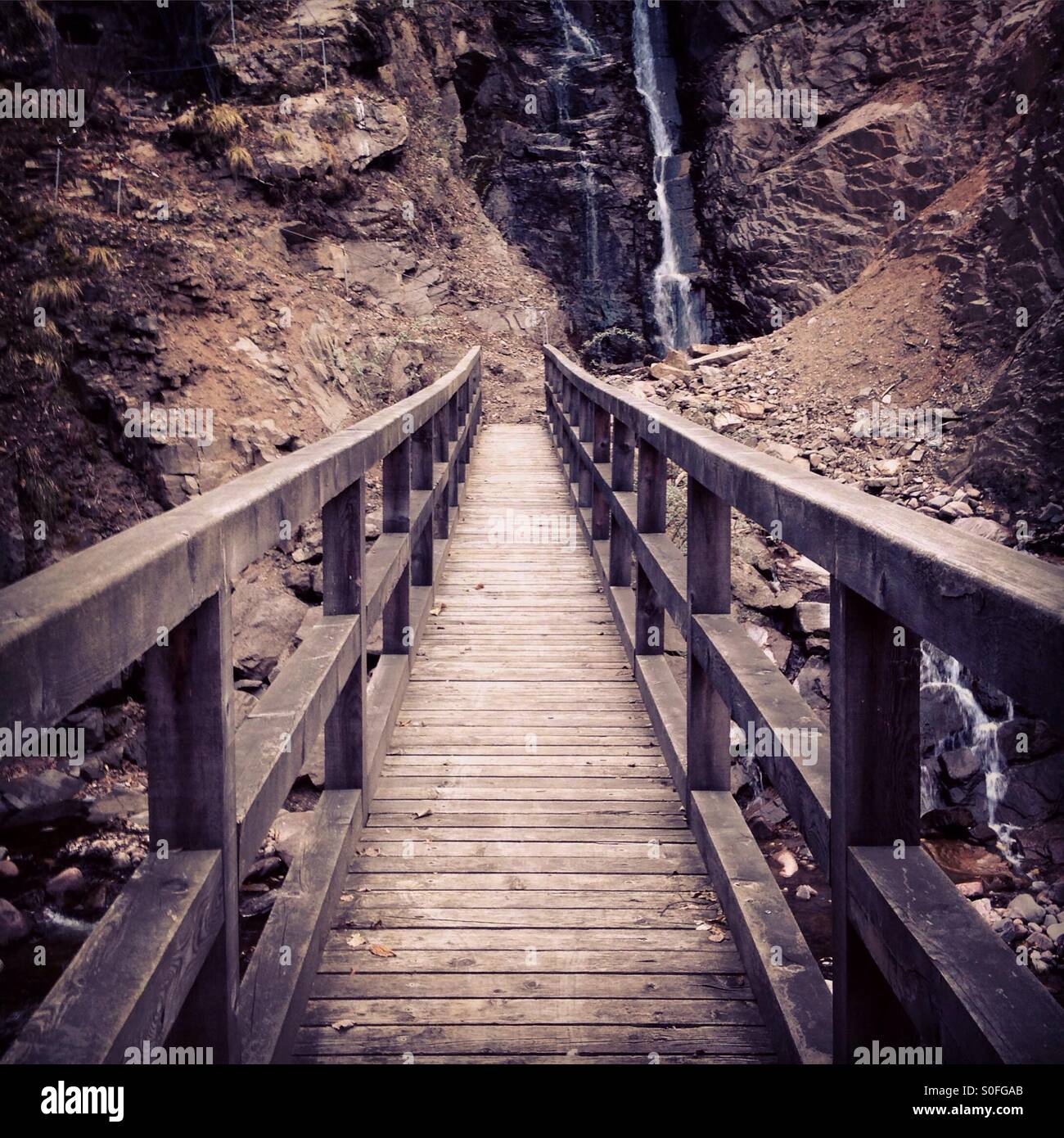 Wood bridge to the waterfall Stock Photo - Alamy