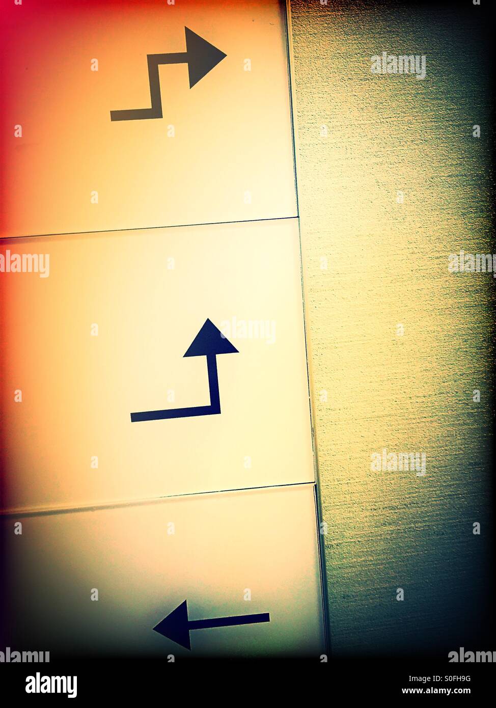 Directional arrows on hall sign Stock Photo - Alamy