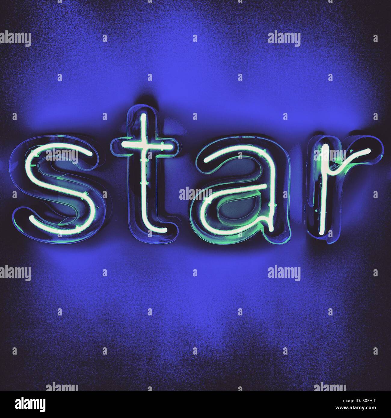 A neon sign spelling Star Stock Photo - Alamy