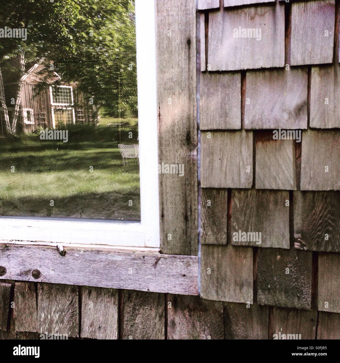 Reflection of house in window Stock Photo - Alamy