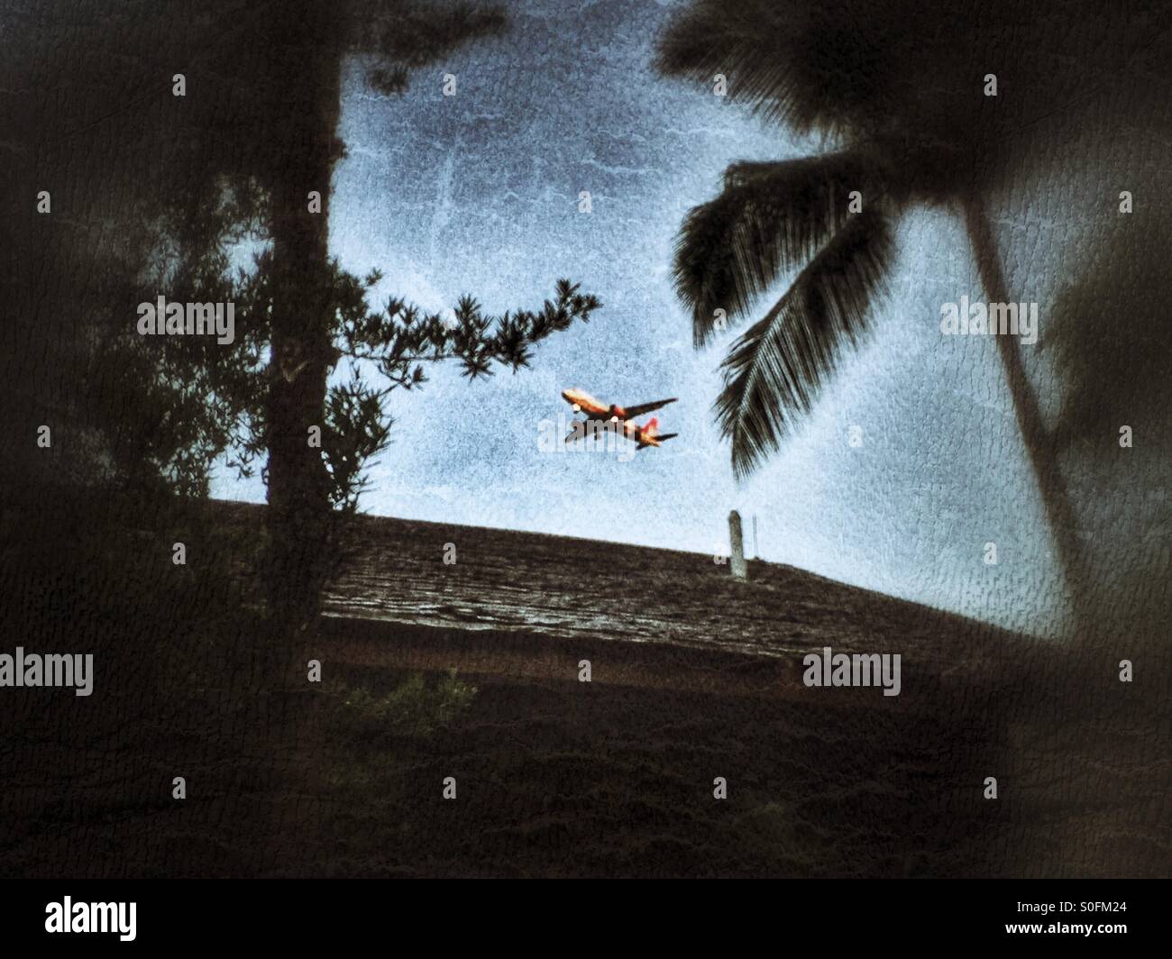 Domestic flight passes by for landing at the nearby airport Stock Photo ...