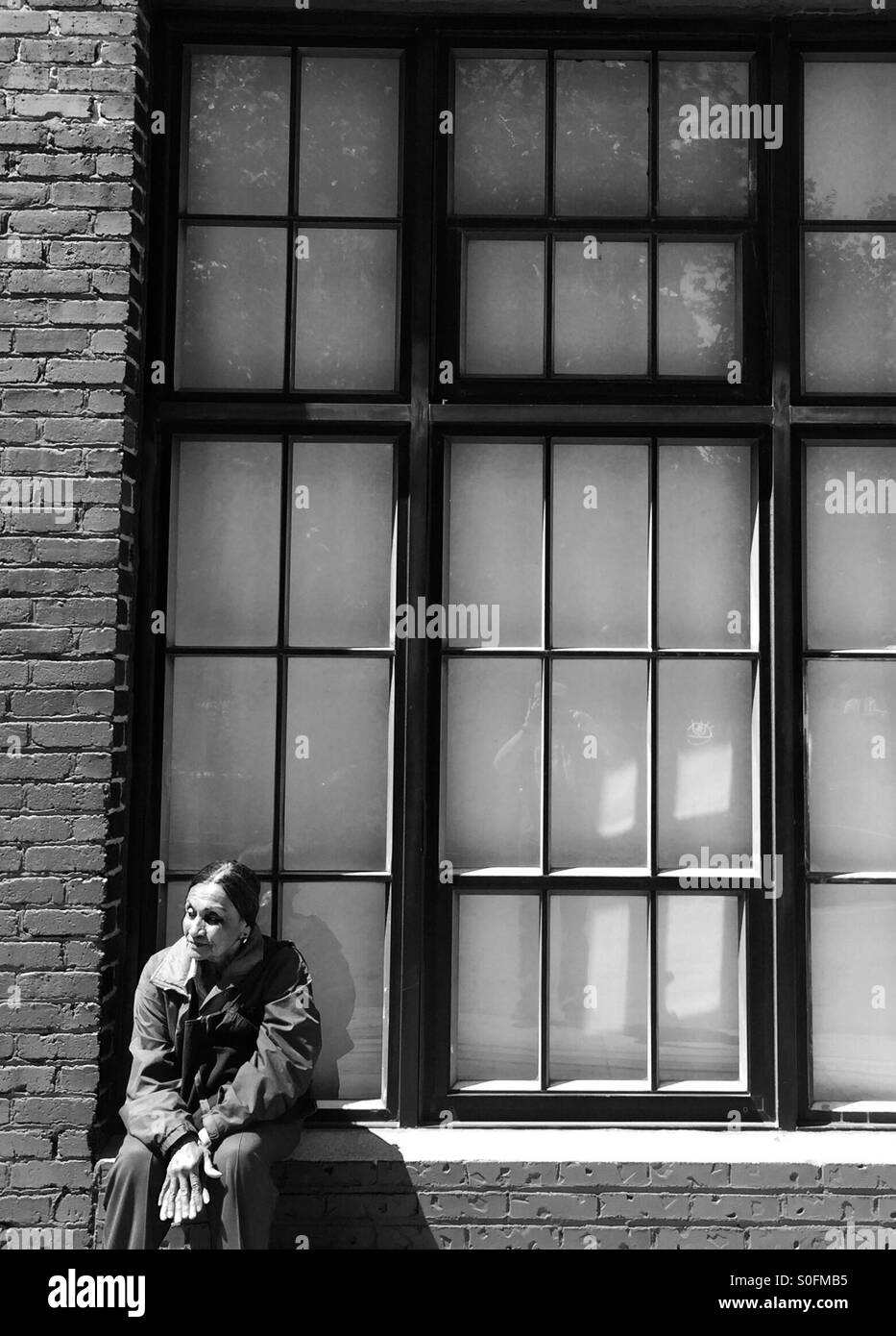 Mexican lady in window Stock Photo - Alamy
