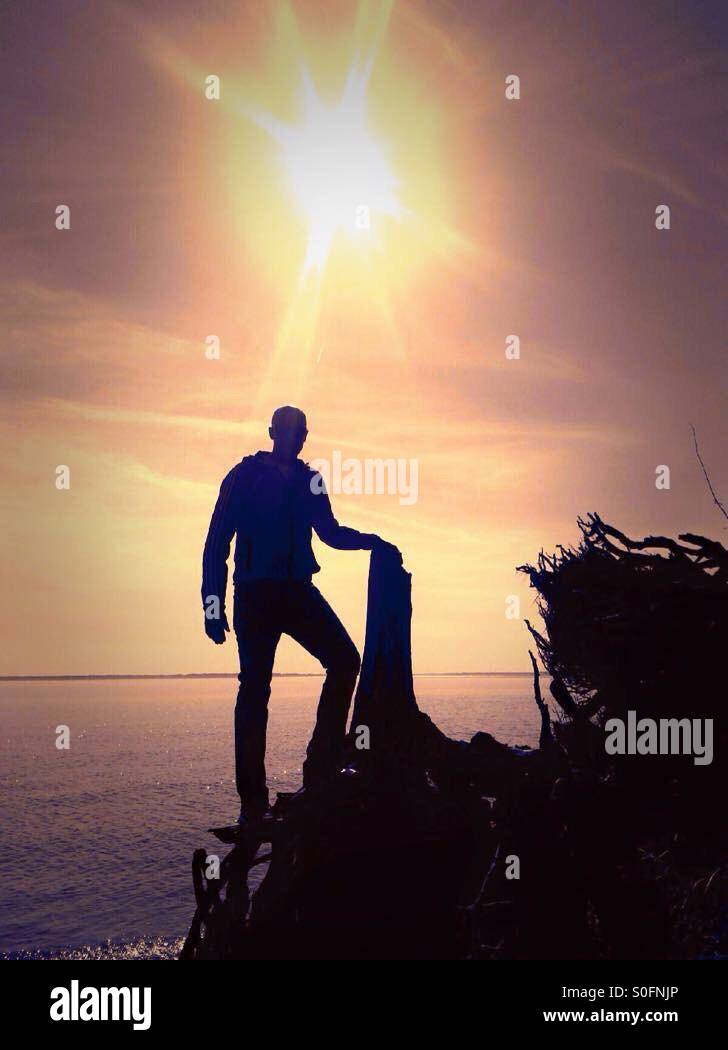 Man in sunset Stock Photo - Alamy