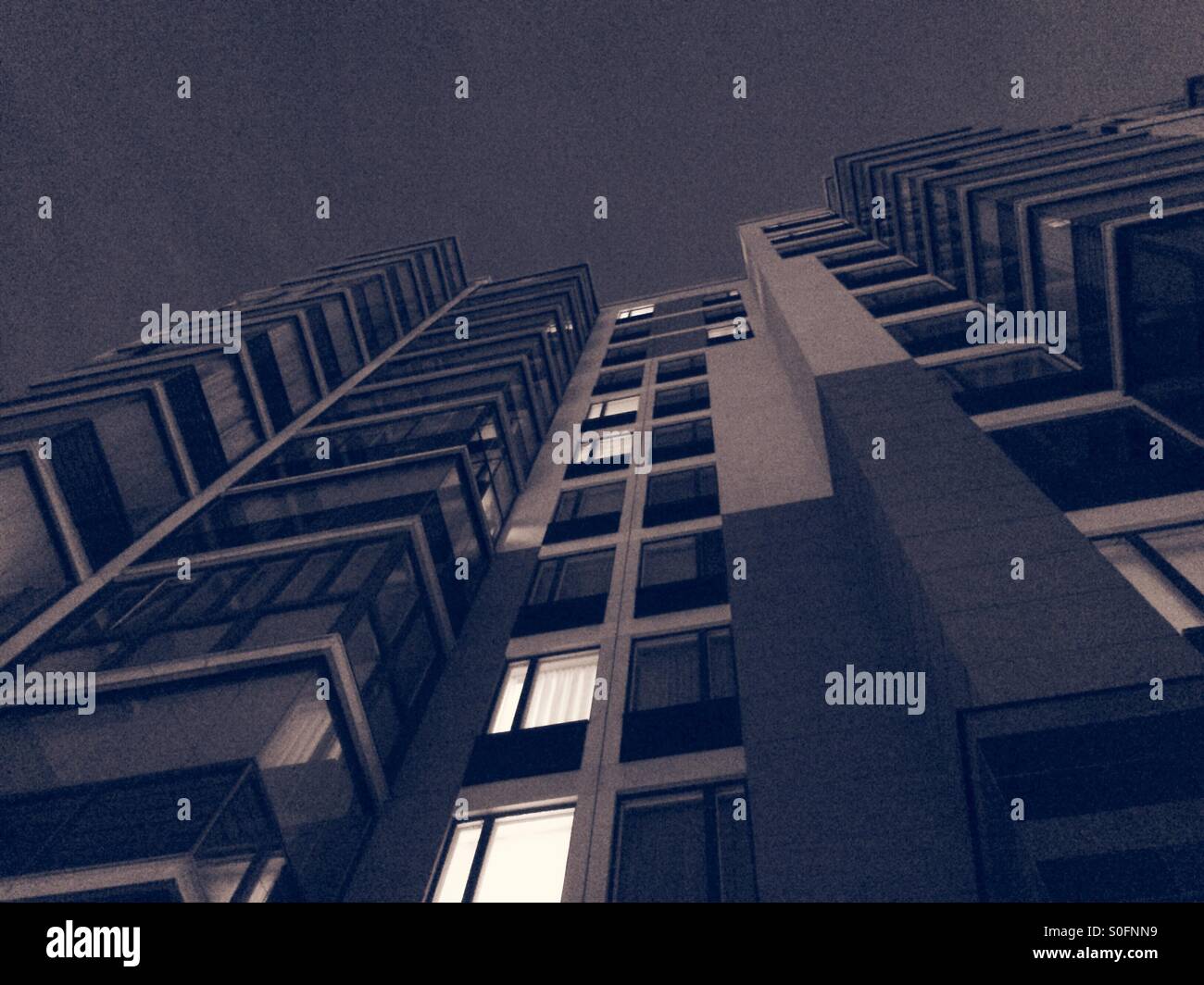Night bottom view of modern house building Stock Photo - Alamy