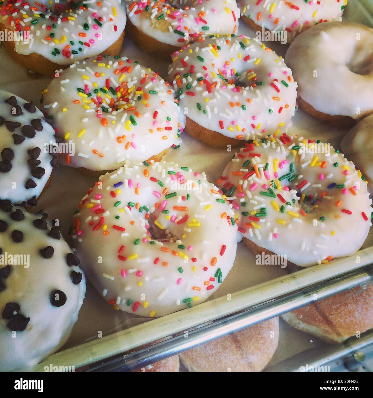 Donut with sprinkles Stock Photo - Alamy