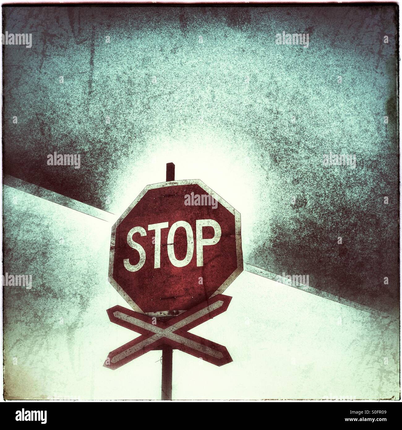 Stop sign at railway crossing Stock Photo - Alamy
