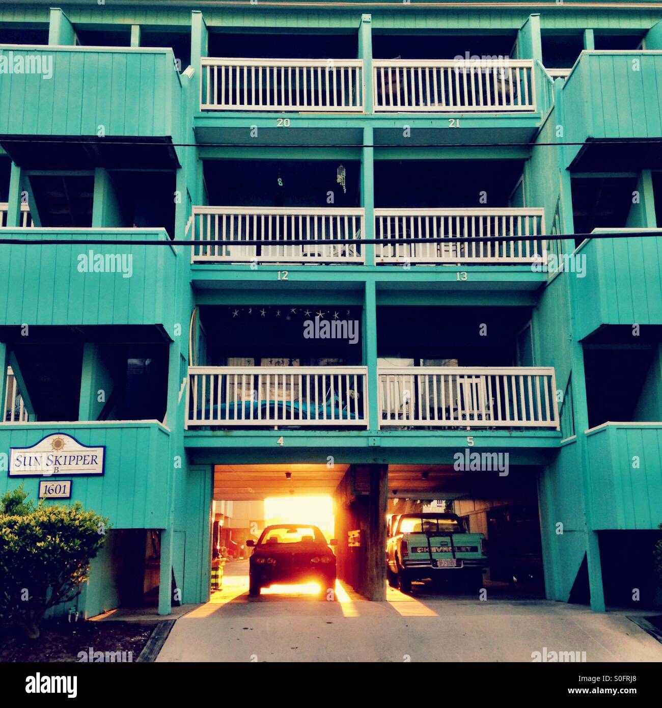 Sunset through the building Stock Photo - Alamy