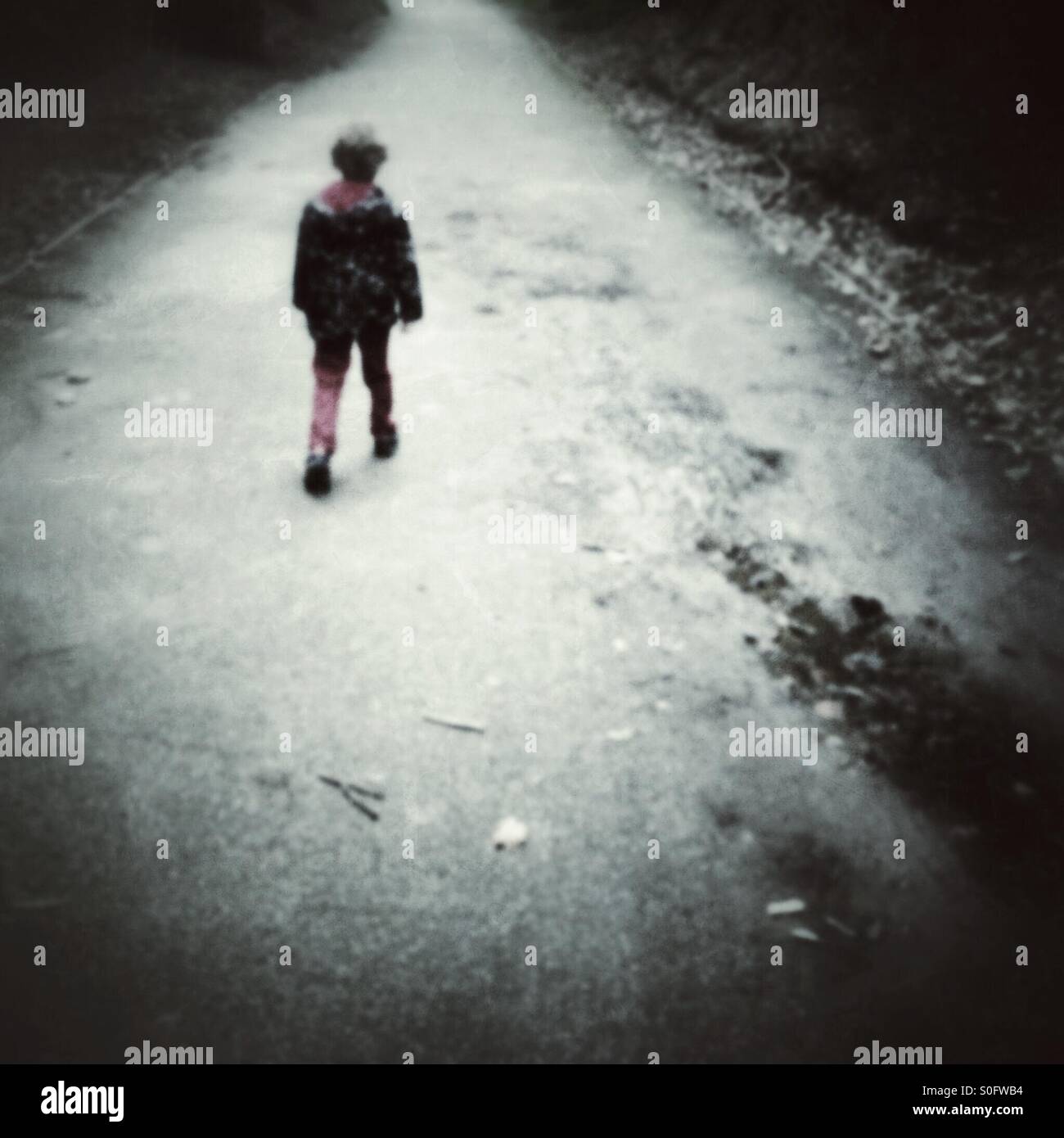 Child walking along a path Stock Photo - Alamy