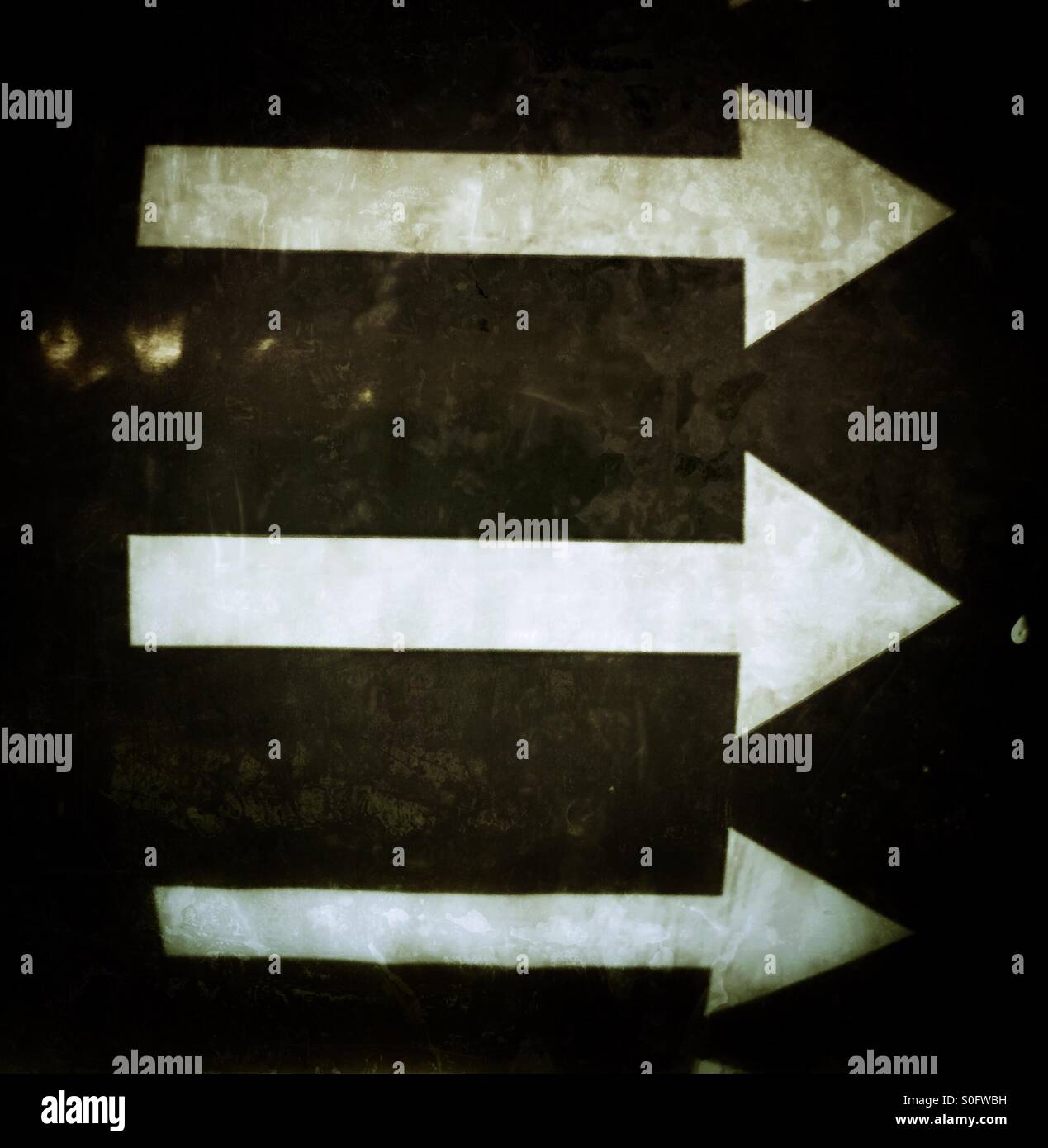 Three arrows in a row Stock Photo - Alamy