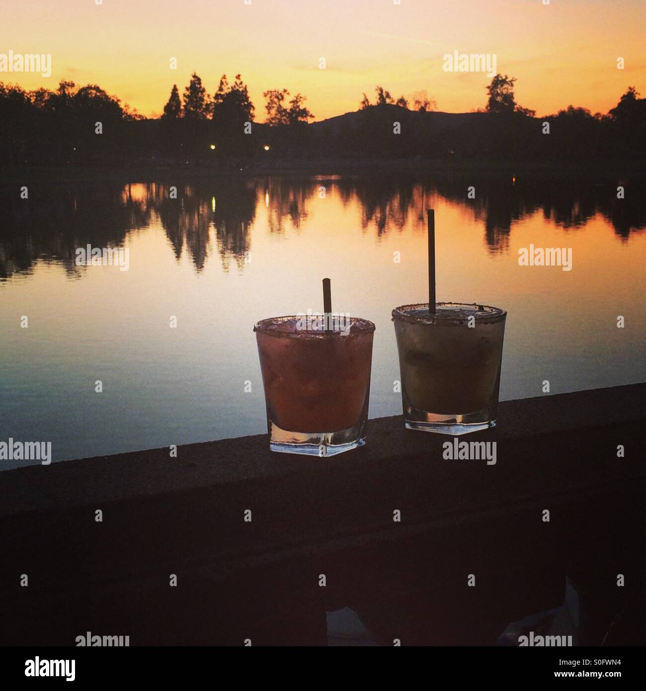 Drinks at sunset hi-res stock photography and images - Alamy