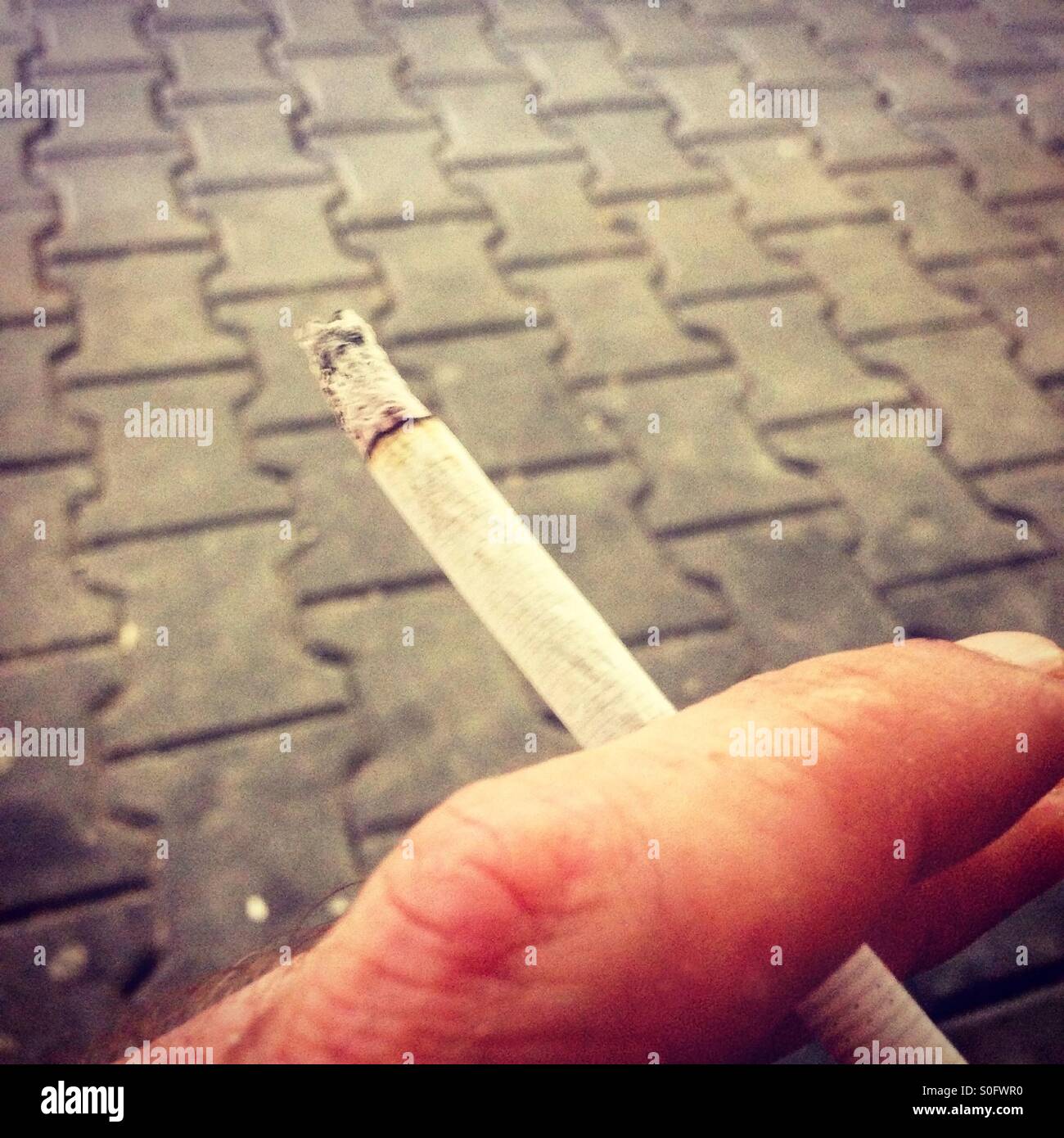 Close-up Of Man Smoking Cigarette Against Trees Stock Photo - Alamy