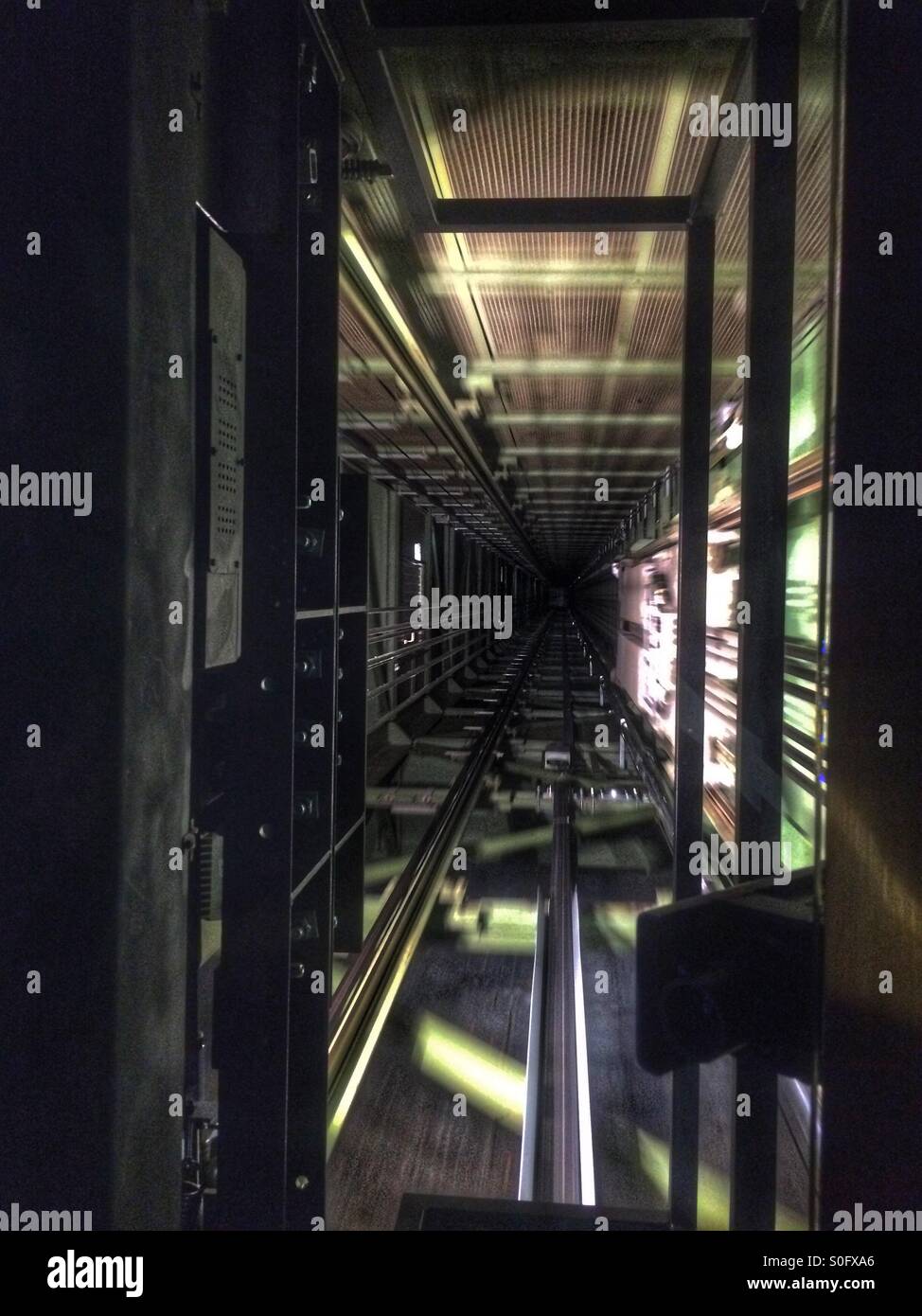 Looking up inside an Elevator made of glass Stock Photo - Alamy