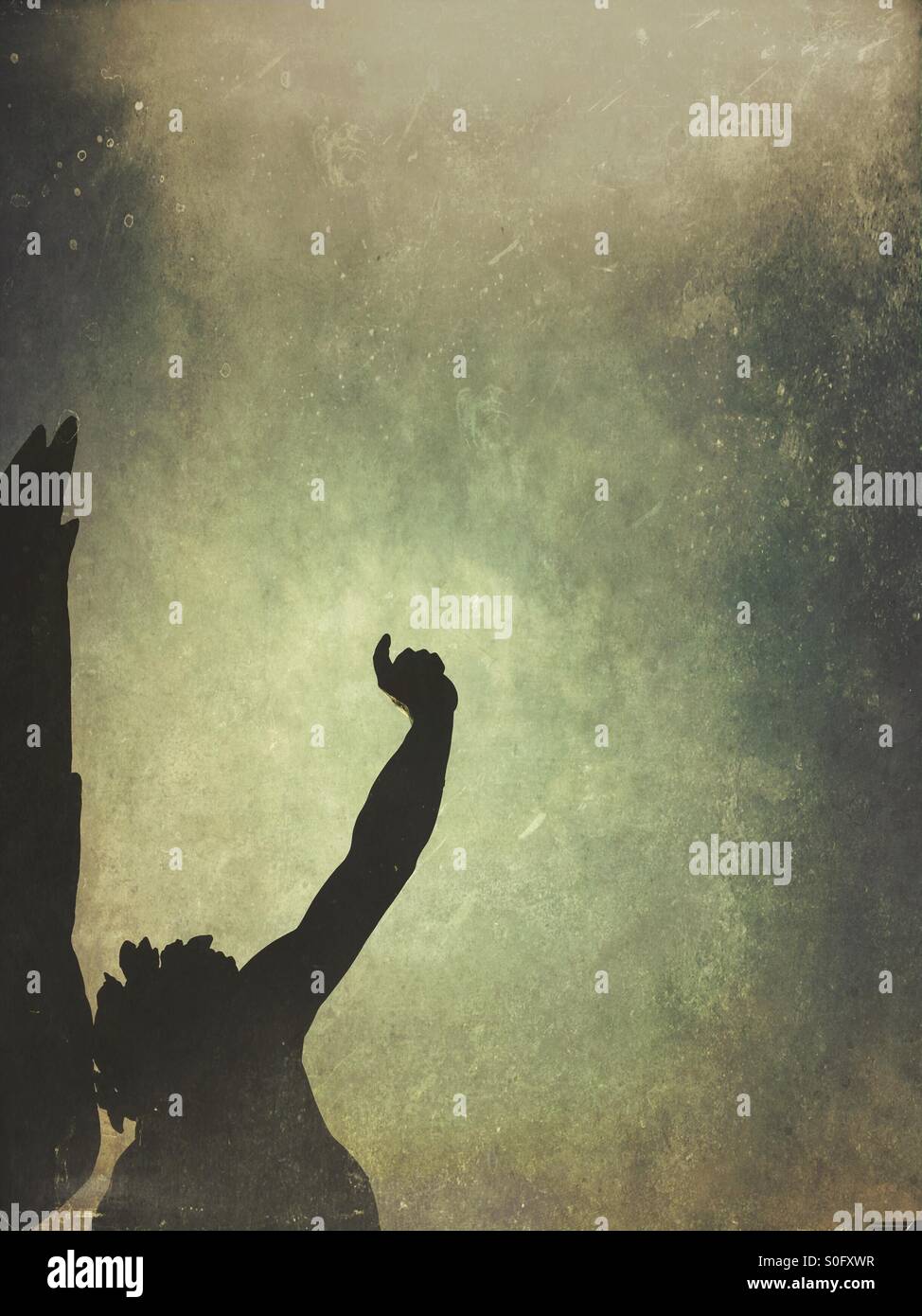 Angel pointing to a dramatic sky Stock Photo - Alamy