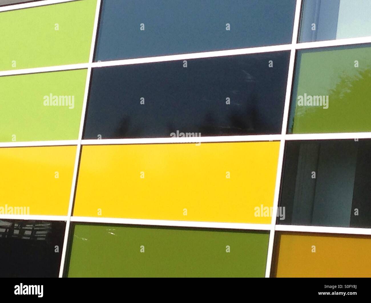 Coloured panels on building Stock Photo - Alamy