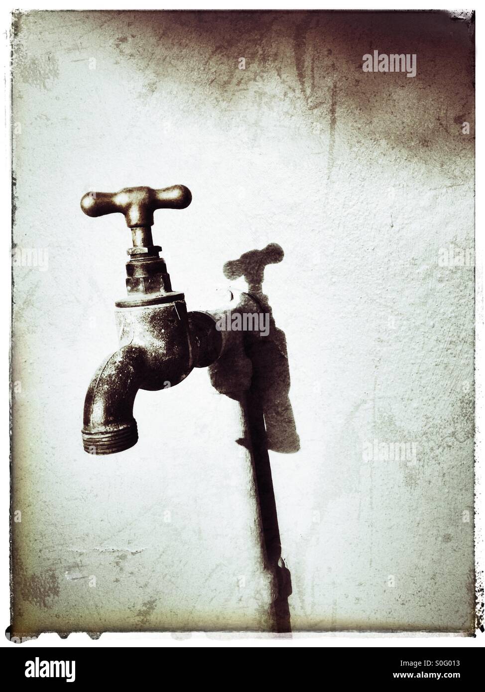 Old tap on wall Stock Photo - Alamy