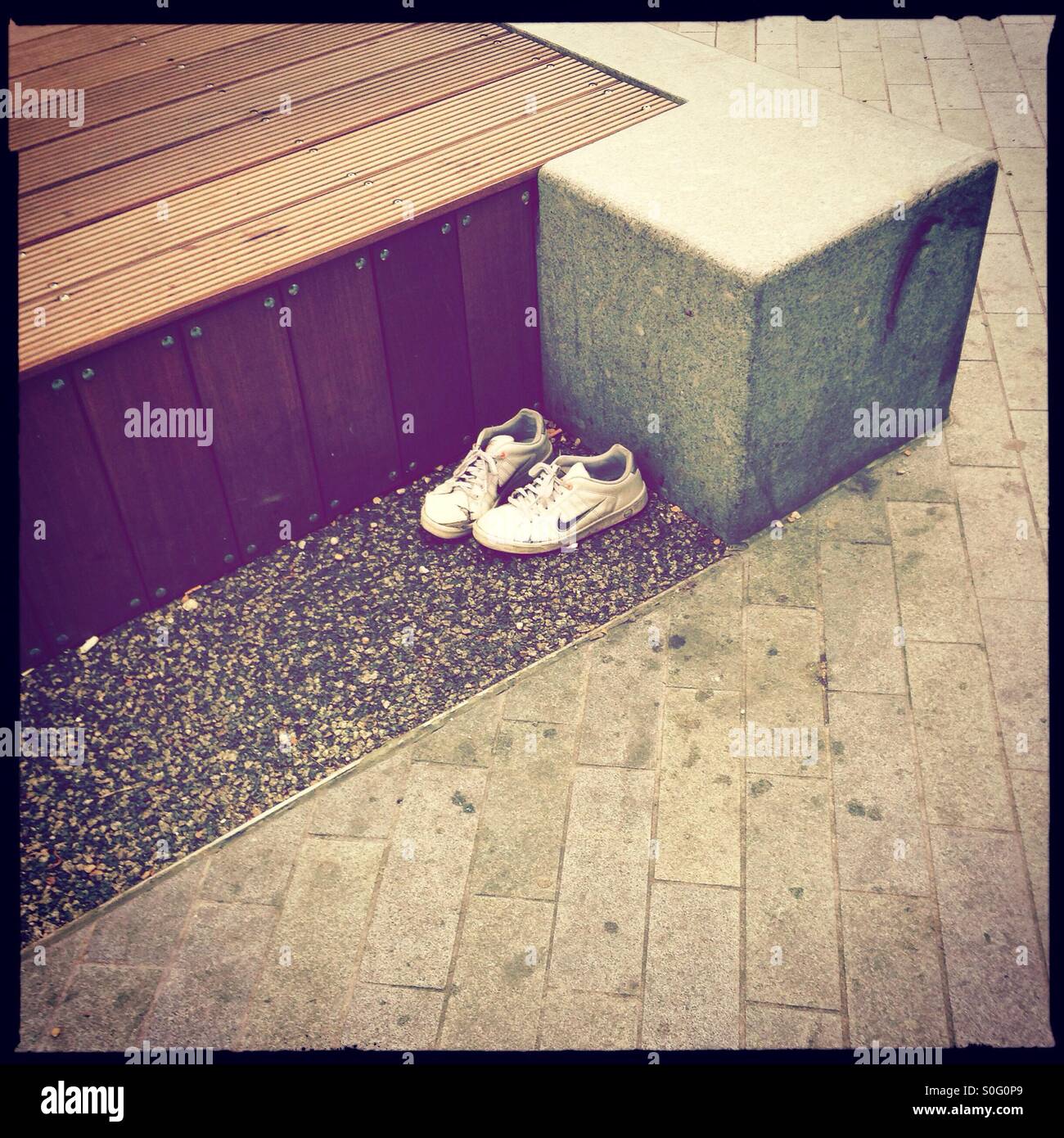 Nike trainers dumped in the street Stock Photo - Alamy