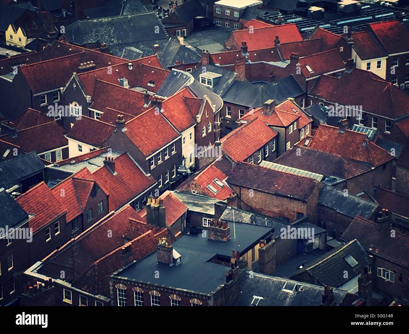 Jagged lines and angles of old tiled roof tops of York viewed from ...