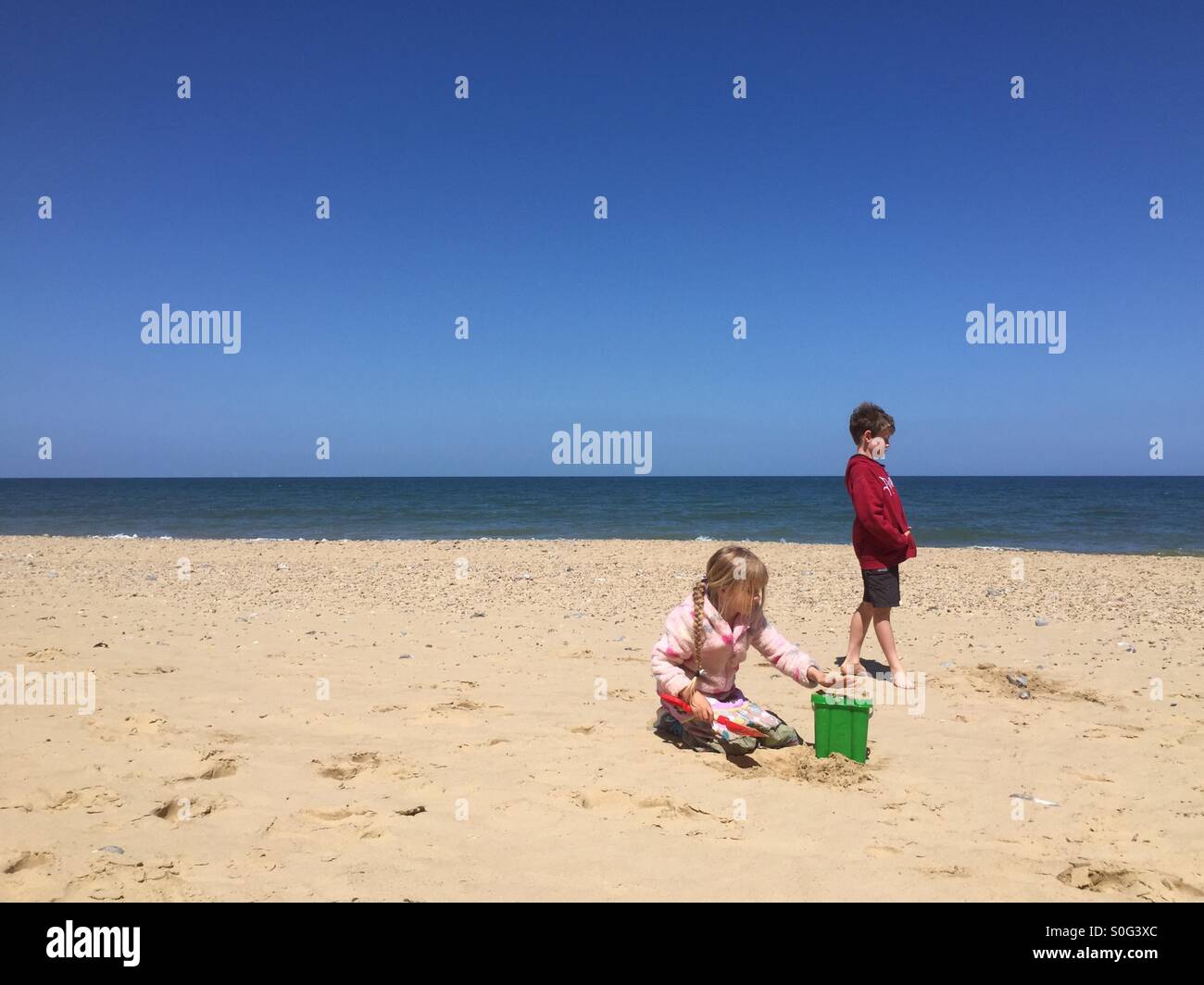 Kids playing on the beach in Norfolk. Showing UK summer beach holiday ...