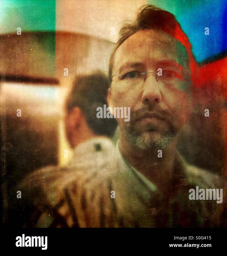 Man with goatee and reflexion in mirror Stock Photo - Alamy